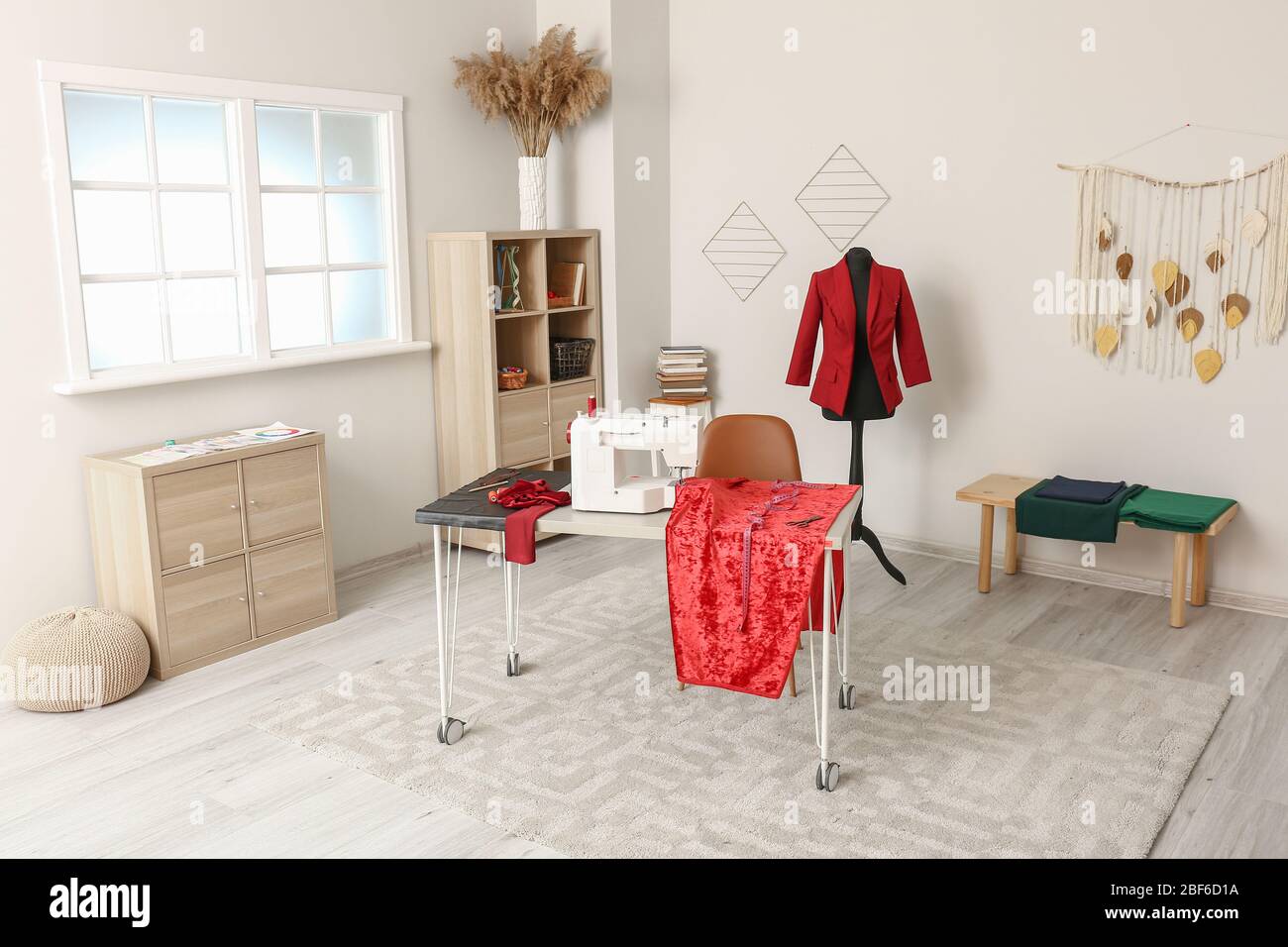 Interior of modern atelier with tailor's workplace Stock Photo - Alamy