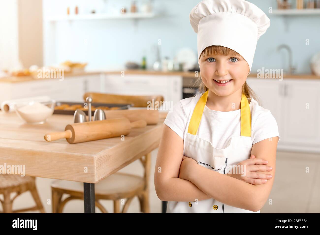 Cute little chef in kitchen Stock Photo - Alamy