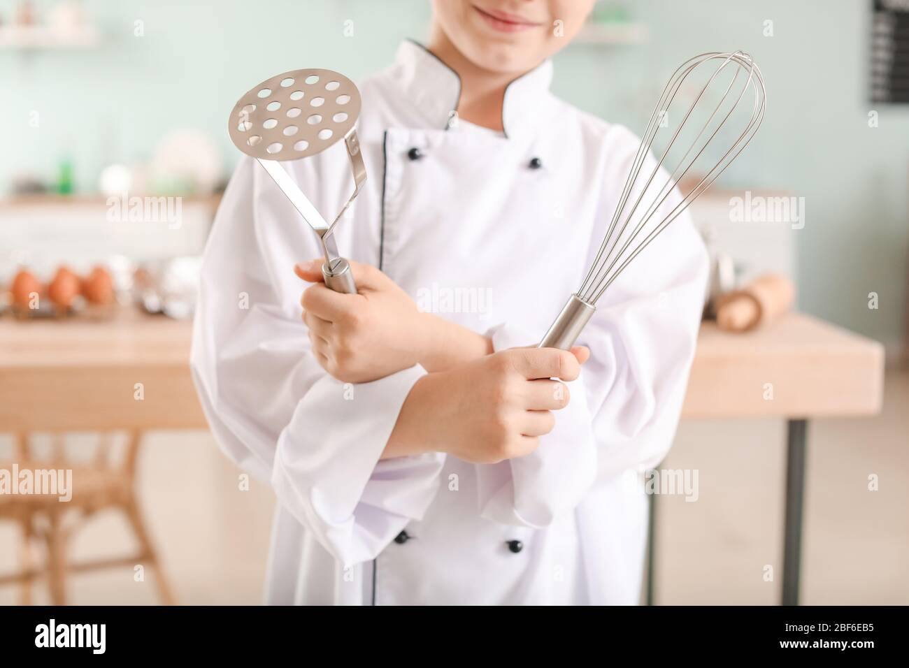 Cute little chef in kitchen Stock Photo - Alamy