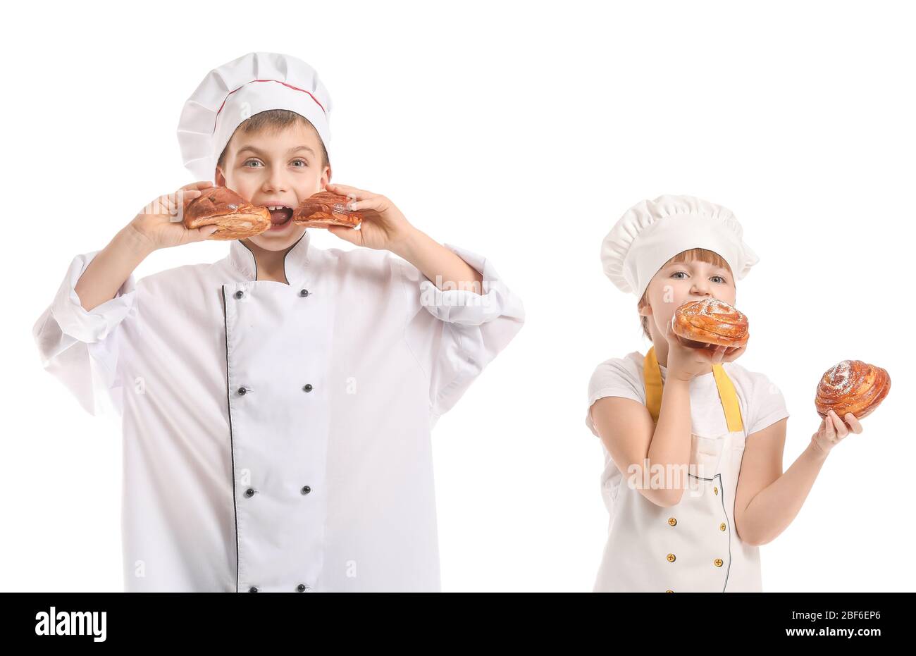 Cute little chefs with pastry on white background Stock Photo - Alamy