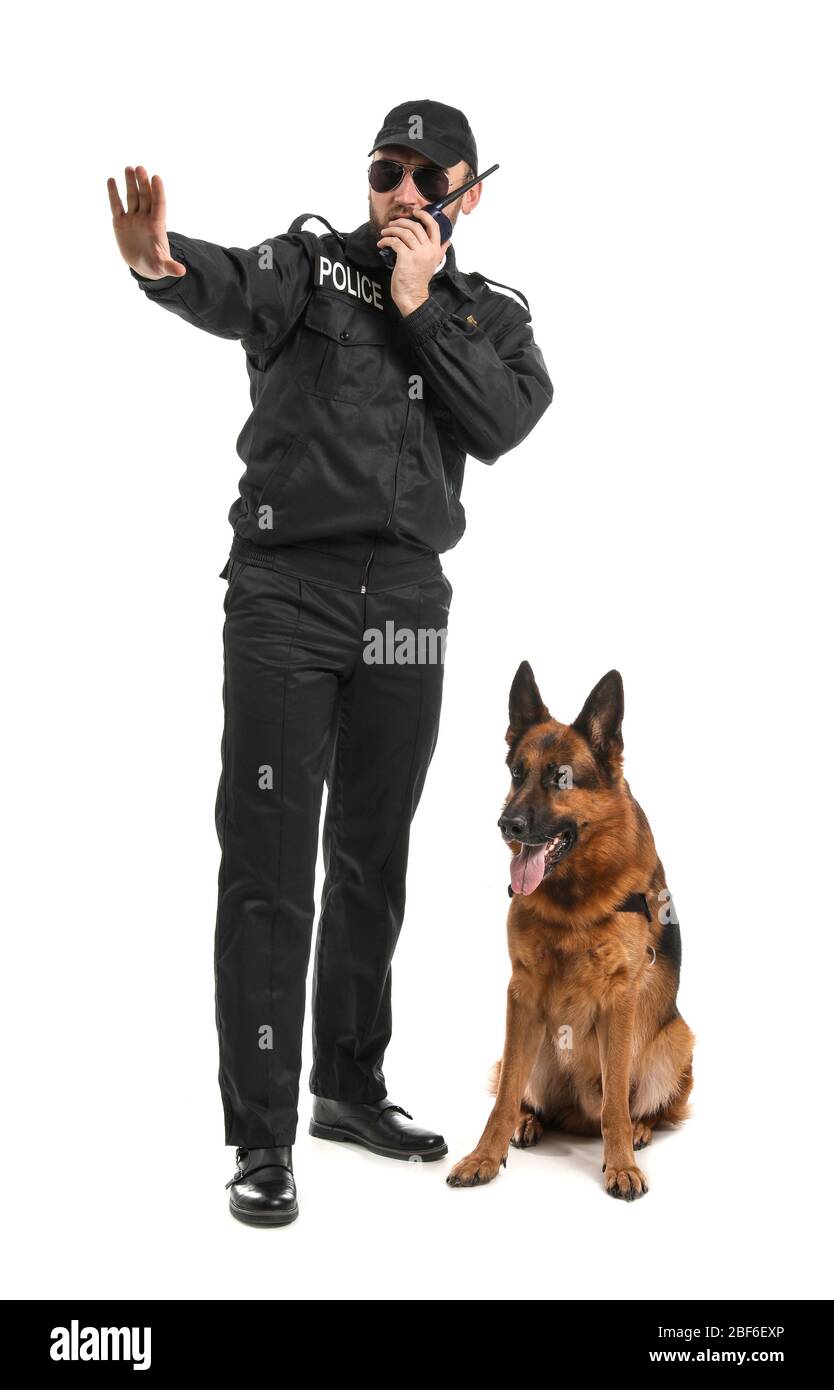 Male police officer with dog on white background Stock Photo - Alamy