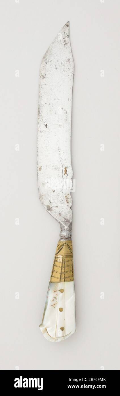 Knife. Sabre-shaped blade with a profiled upper edge, plain bolster and ...