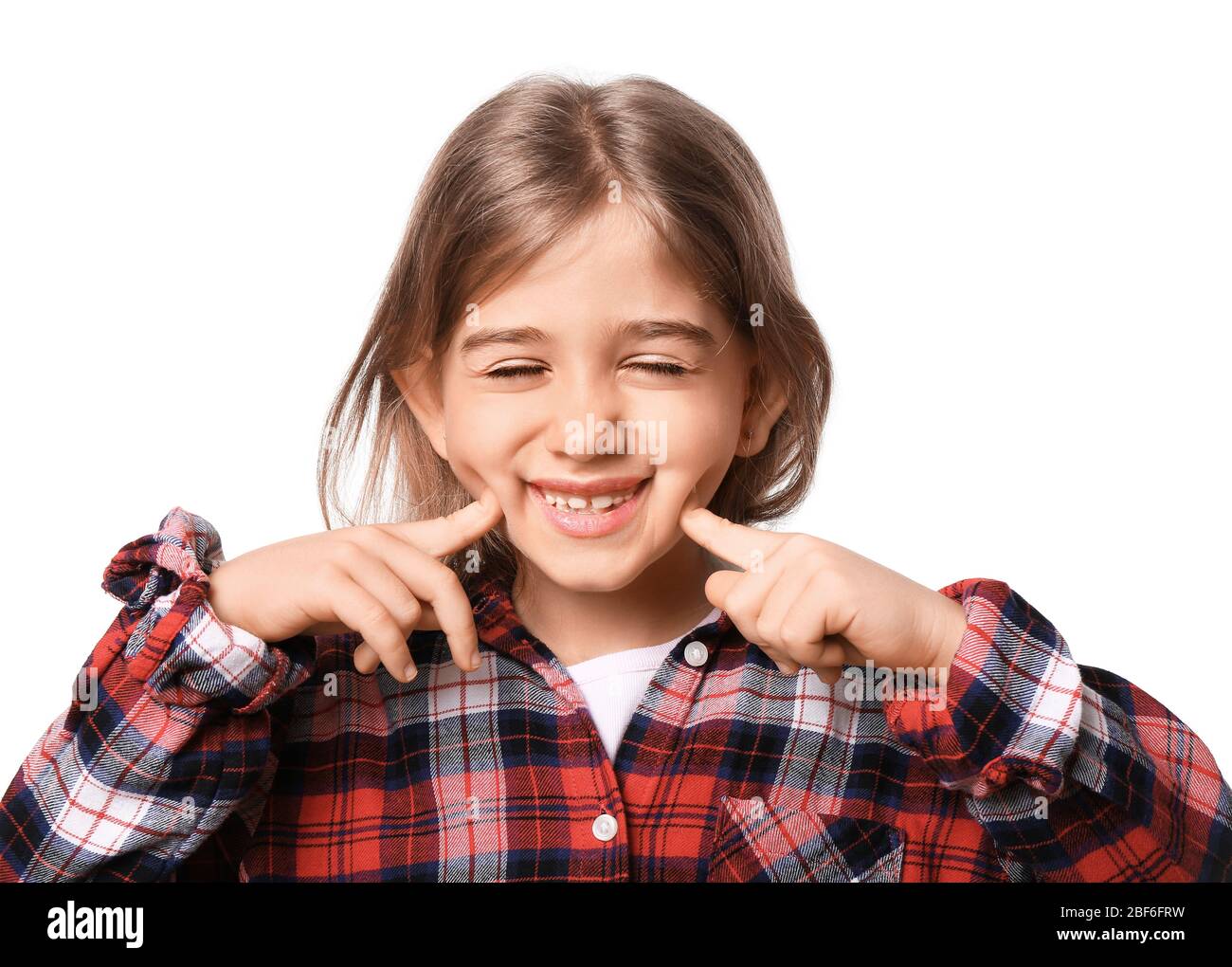 Happy little girl with healthy teeth on white background Stock Photo ...