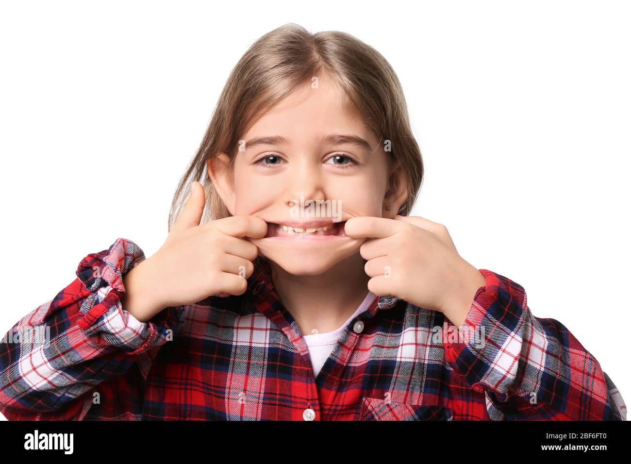 Happy little girl with healthy teeth on white background Stock Photo ...