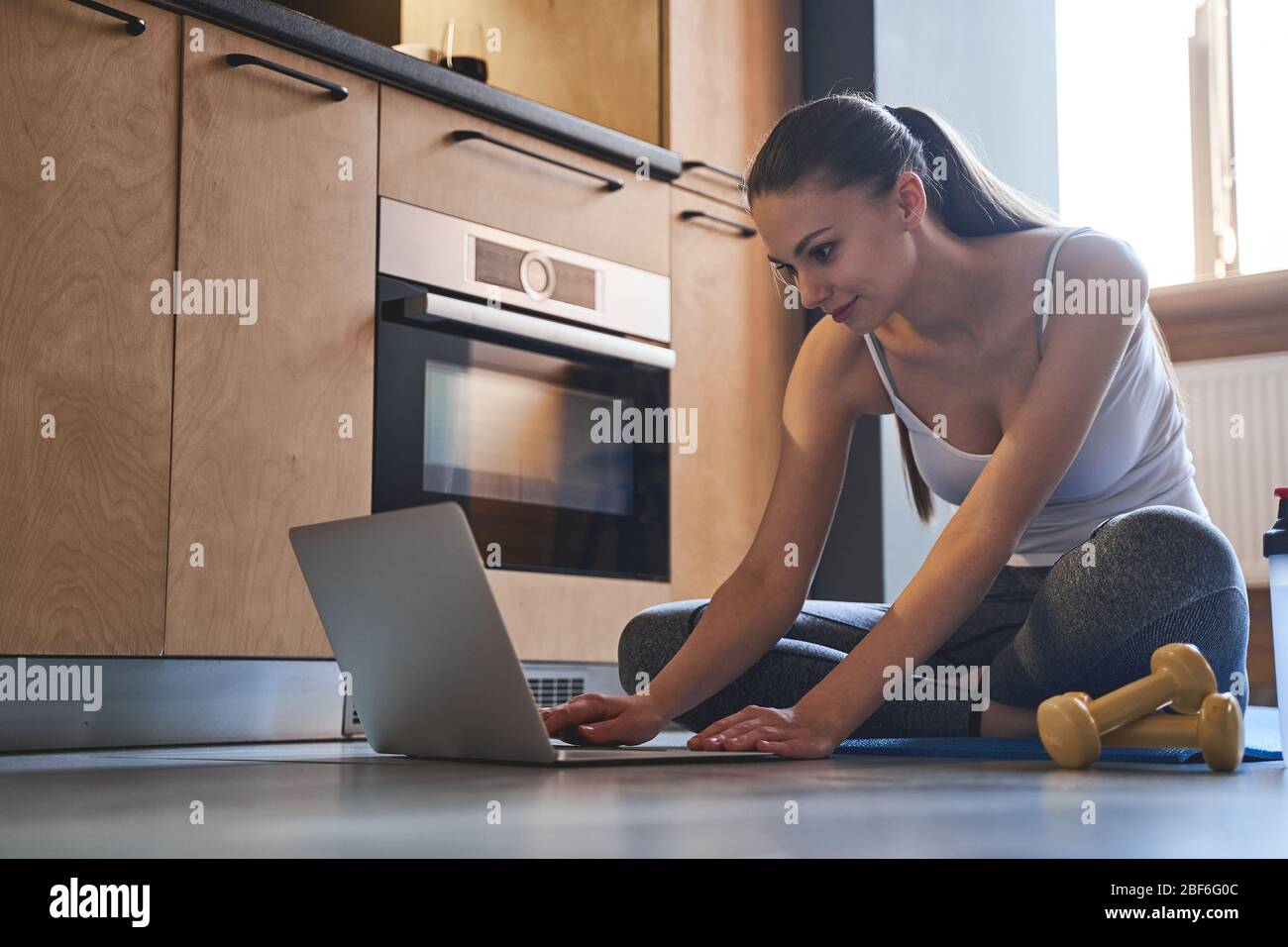 Young woman staring at a laptop screen Stock Photo - Alamy