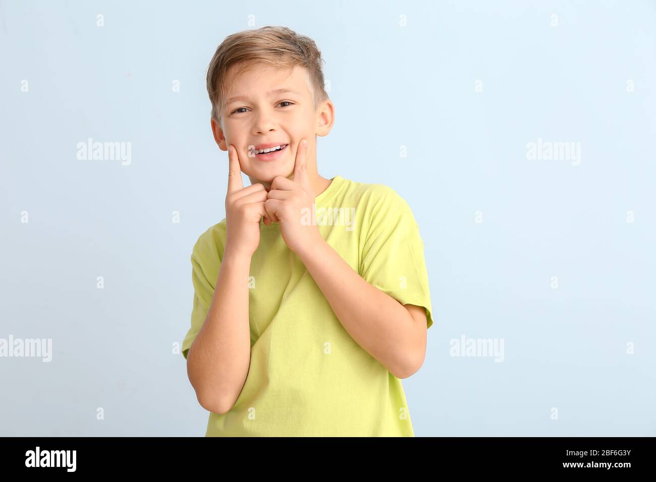 Happy little boy with healthy teeth on white background Stock Photo - Alamy