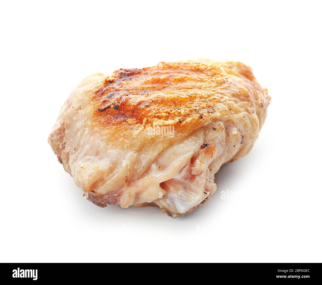 Cooked chicken thigh on white background Stock Photo - Alamy