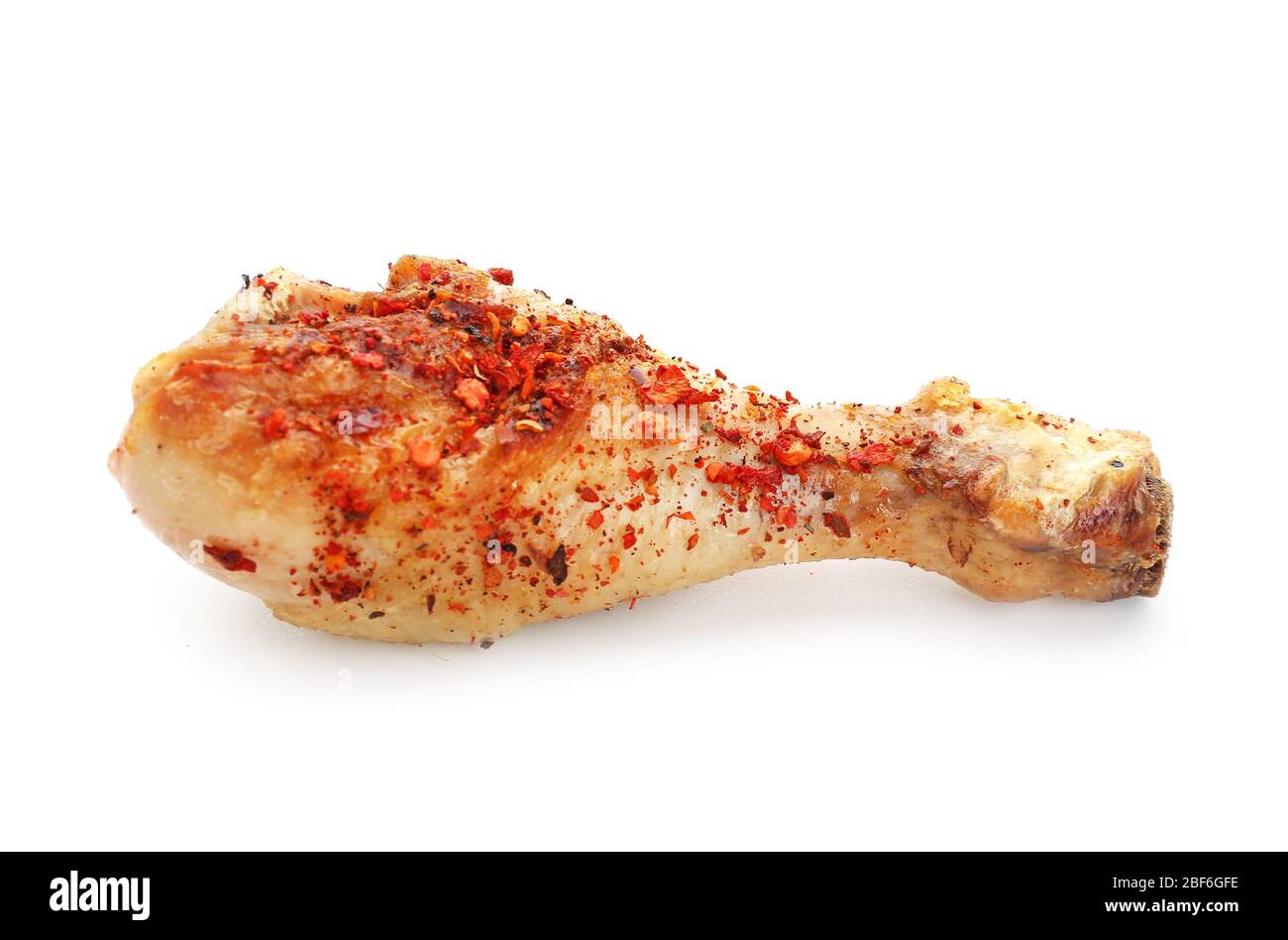 Cooked chicken drumstick on white background Stock Photo - Alamy