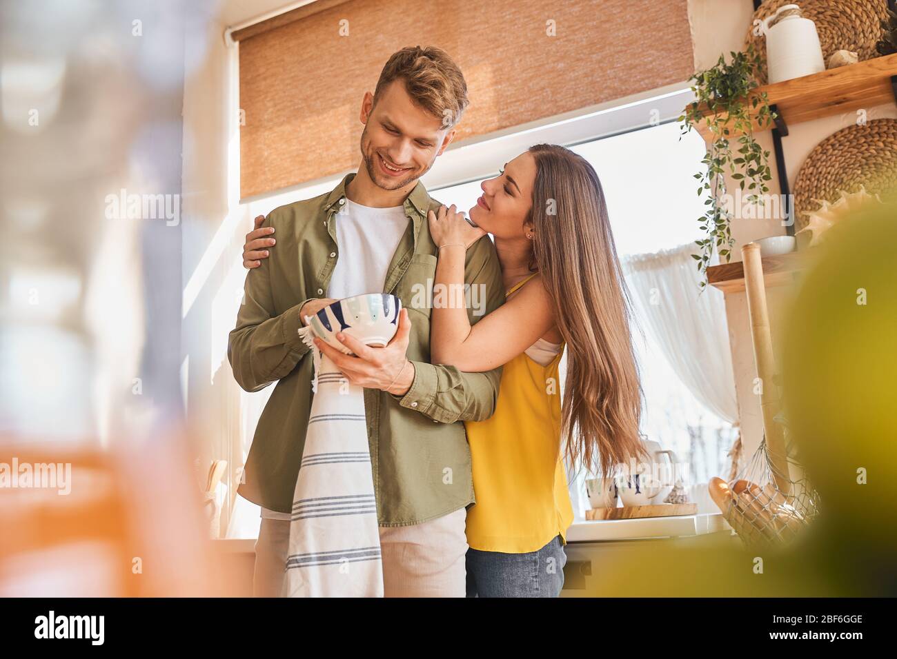 Charming longhaired female person embracing her partner Stock Photo - Alamy