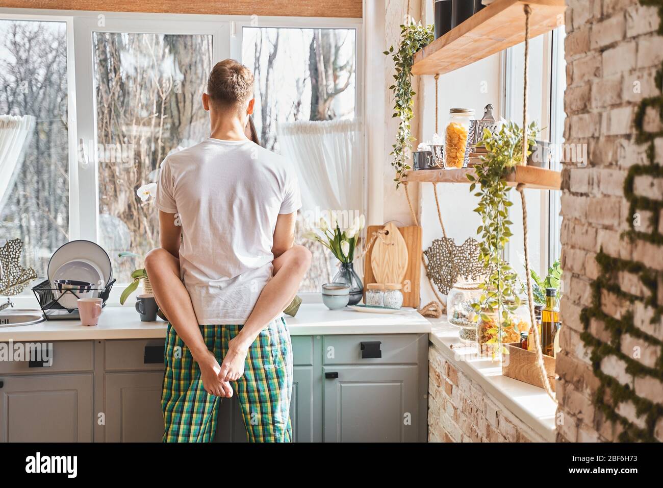 Sporty young man standing with back to camera Stock Photo - Alamy
