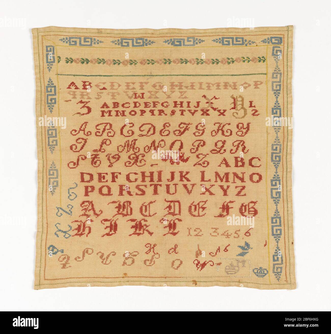 Sampler. Alphabets and numerals with one cross border in rose pattern ...