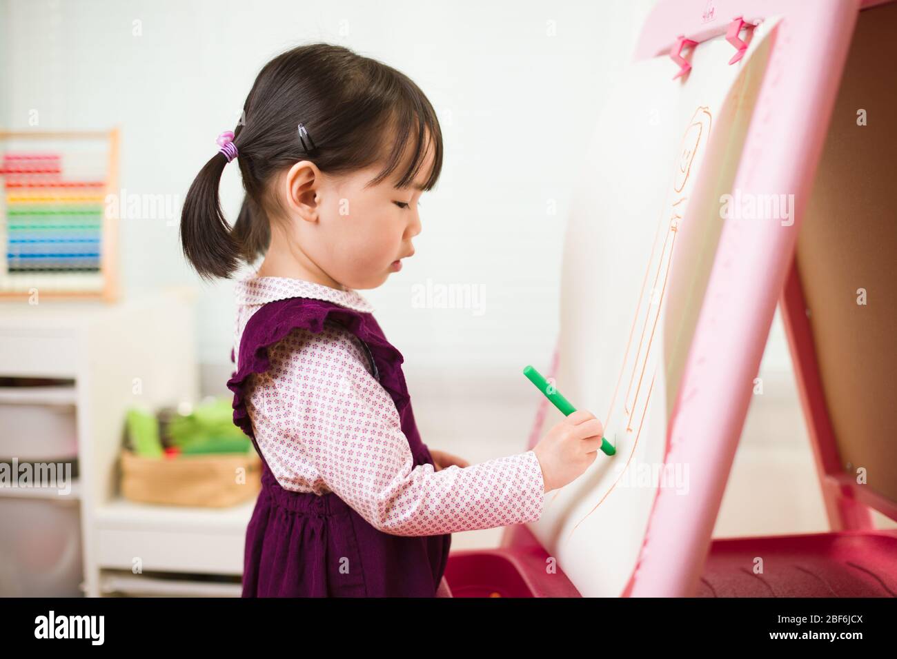 toddler girl practice painting for homeschooling Stock Photo - Alamy