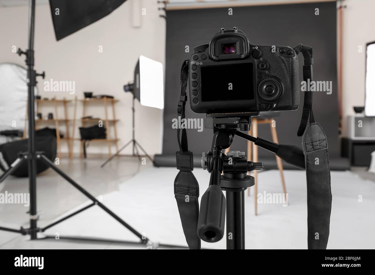 Modern camera in professional photo studio Stock Photo - Alamy