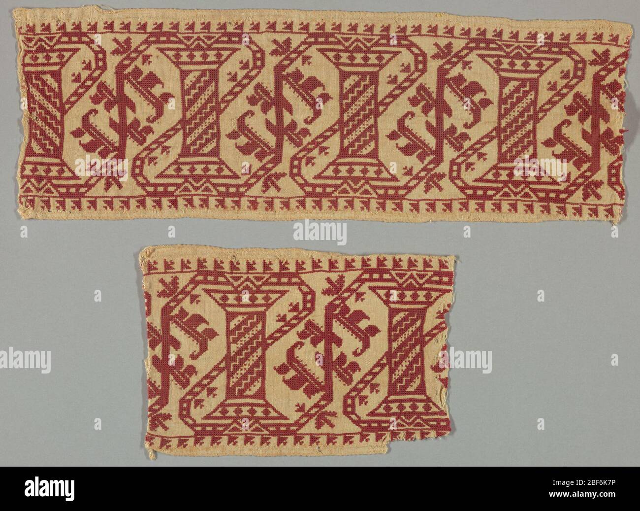 Band. Two sections of an embroidered band with the repeat of a pillar ...