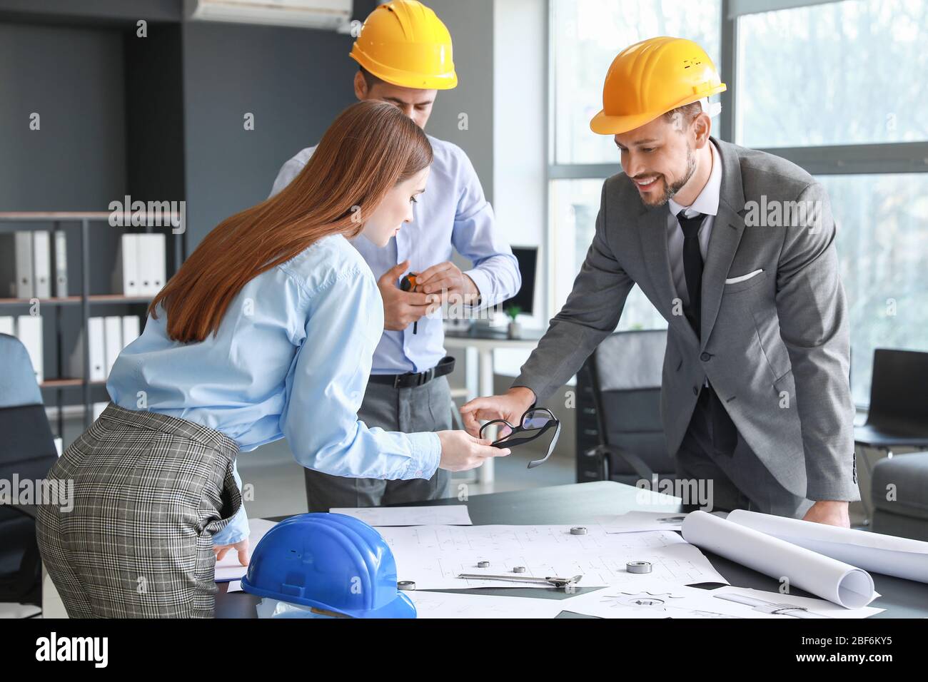 Group of engineers working in office Stock Photo - Alamy