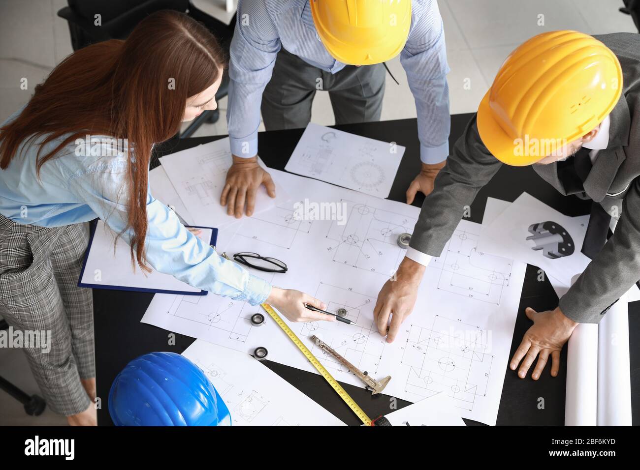 Group of engineers working in office Stock Photo - Alamy