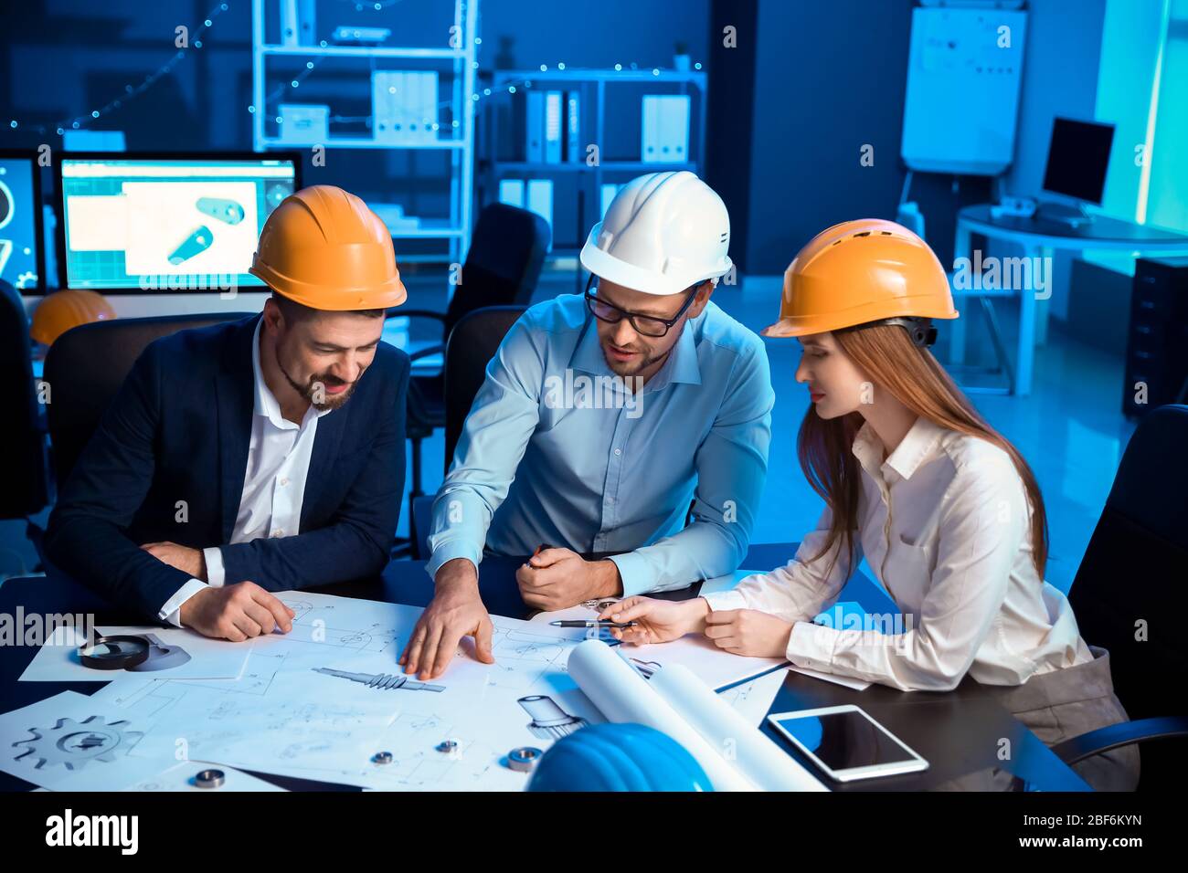 Engineers working in office at night Stock Photo - Alamy