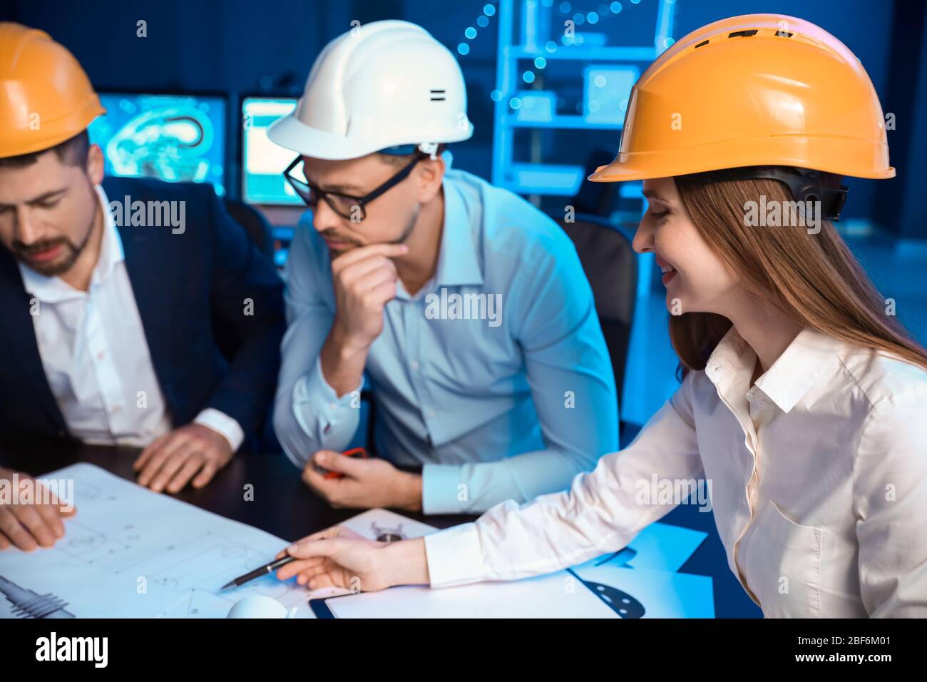 Engineers working in office at night Stock Photo - Alamy