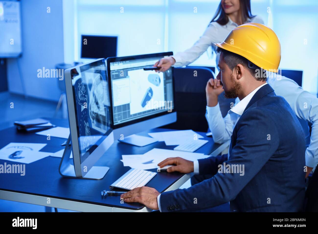 Engineers working in office at night Stock Photo - Alamy