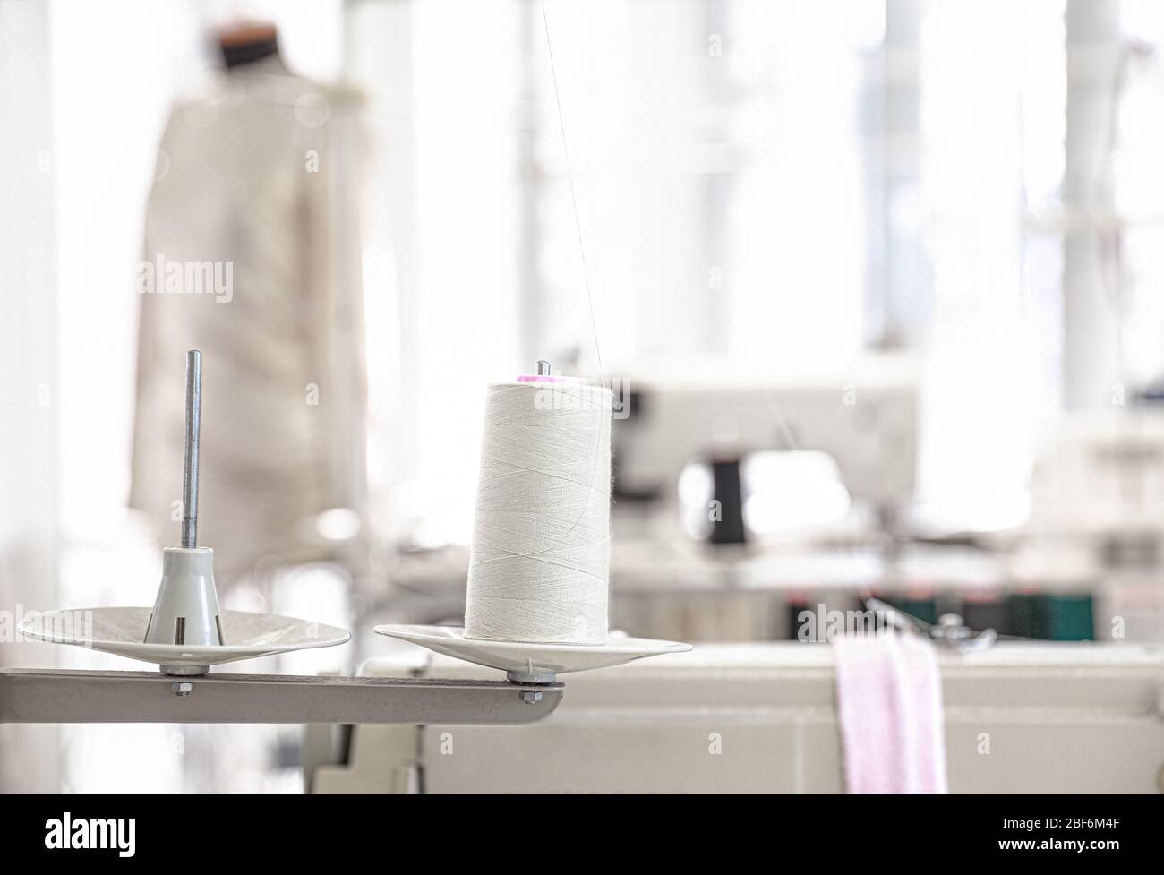 Spool of threads in tailor workshop Stock Photo - Alamy