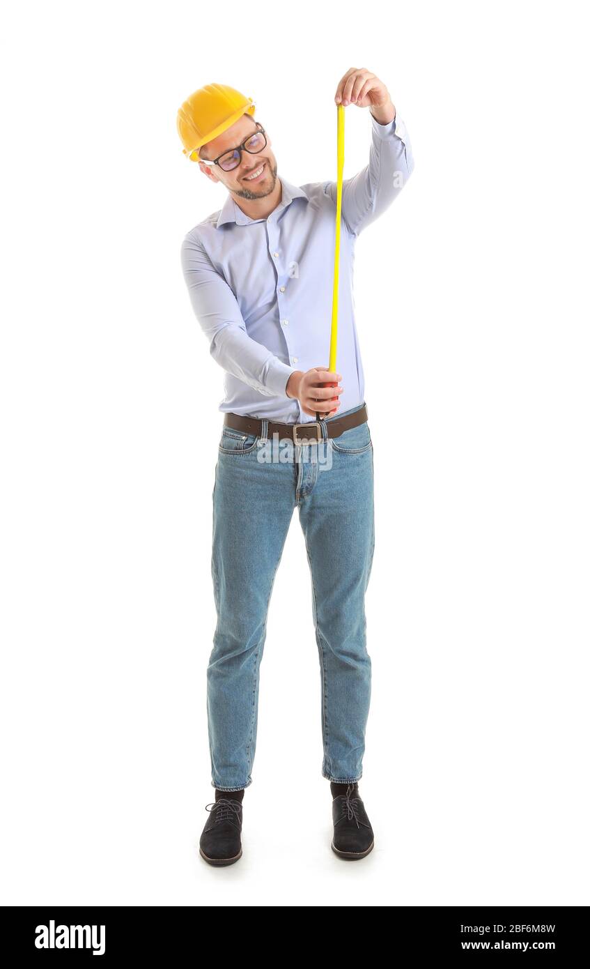 Male engineer with tape measure on white background Stock Photo - Alamy