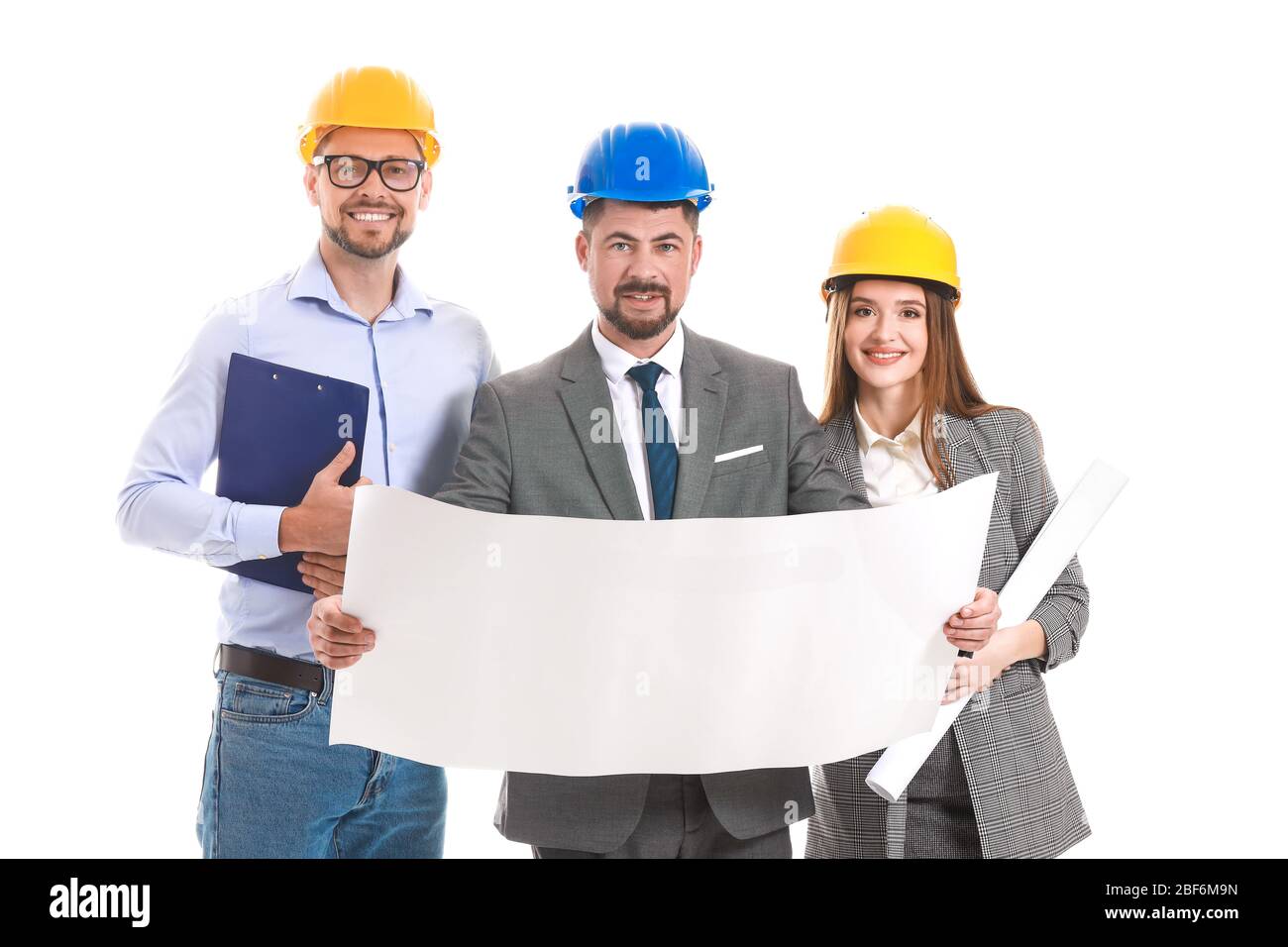 Group of engineers with drawing on white background Stock Photo - Alamy