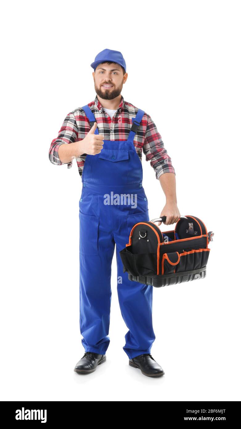 Handsome plumber showing thumb-up on white background Stock Photo - Alamy