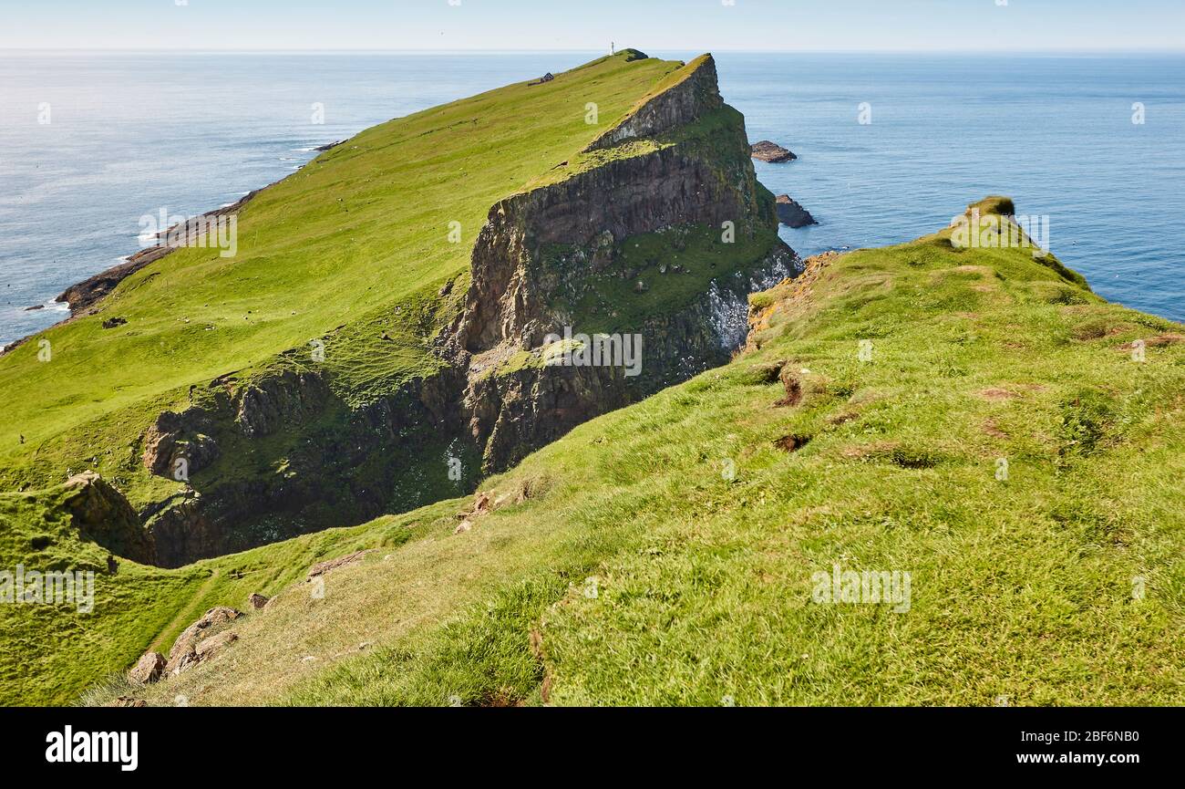 Mykines lighthouse and cliffs on Faroe islands. Hiking highlight ...