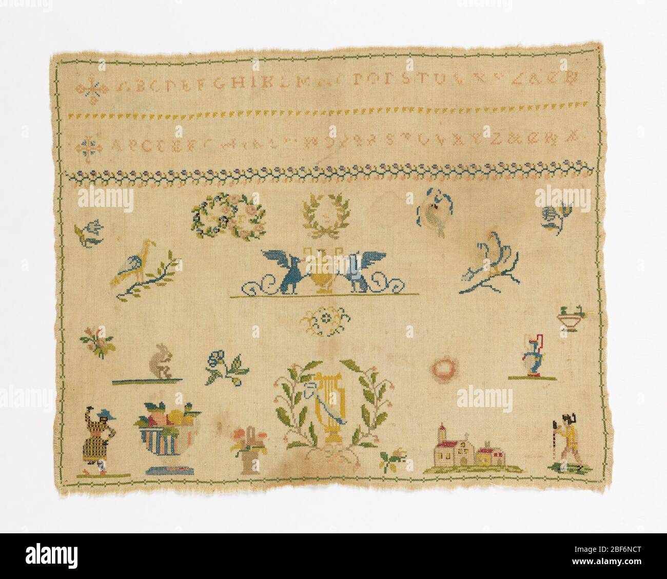 Sampler. Alphabets, floral cross border, and designs of birds, animals ...