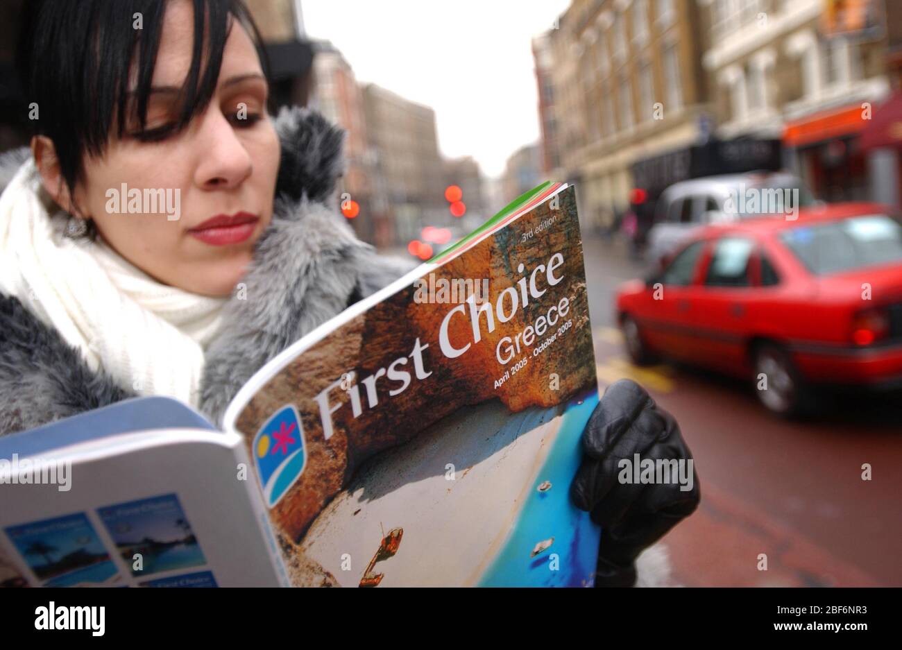 A woman browsing a First Choice holiday brochure Stock Photo - Alamy