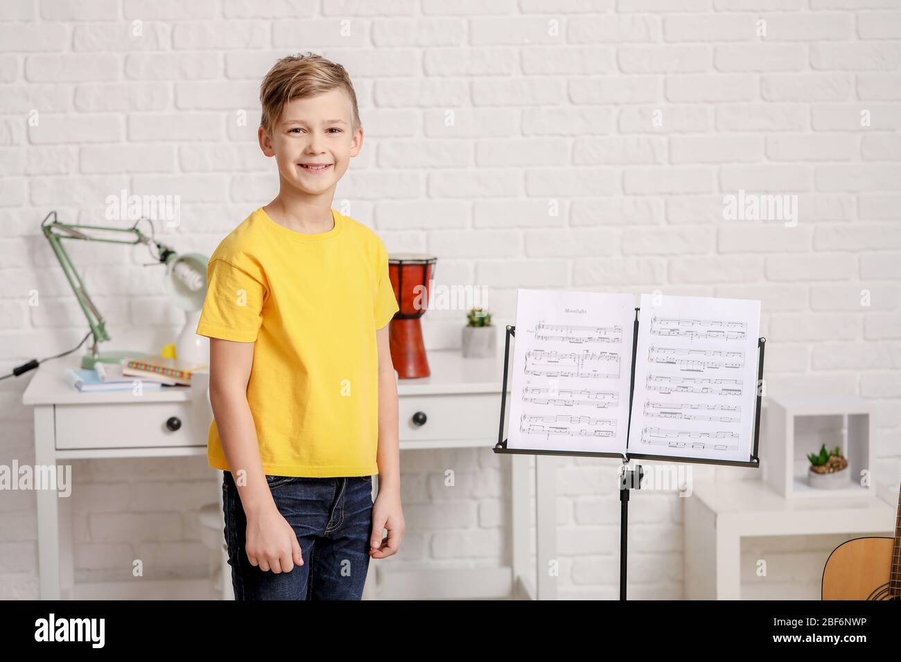Cute little boy at music school Stock Photo - Alamy