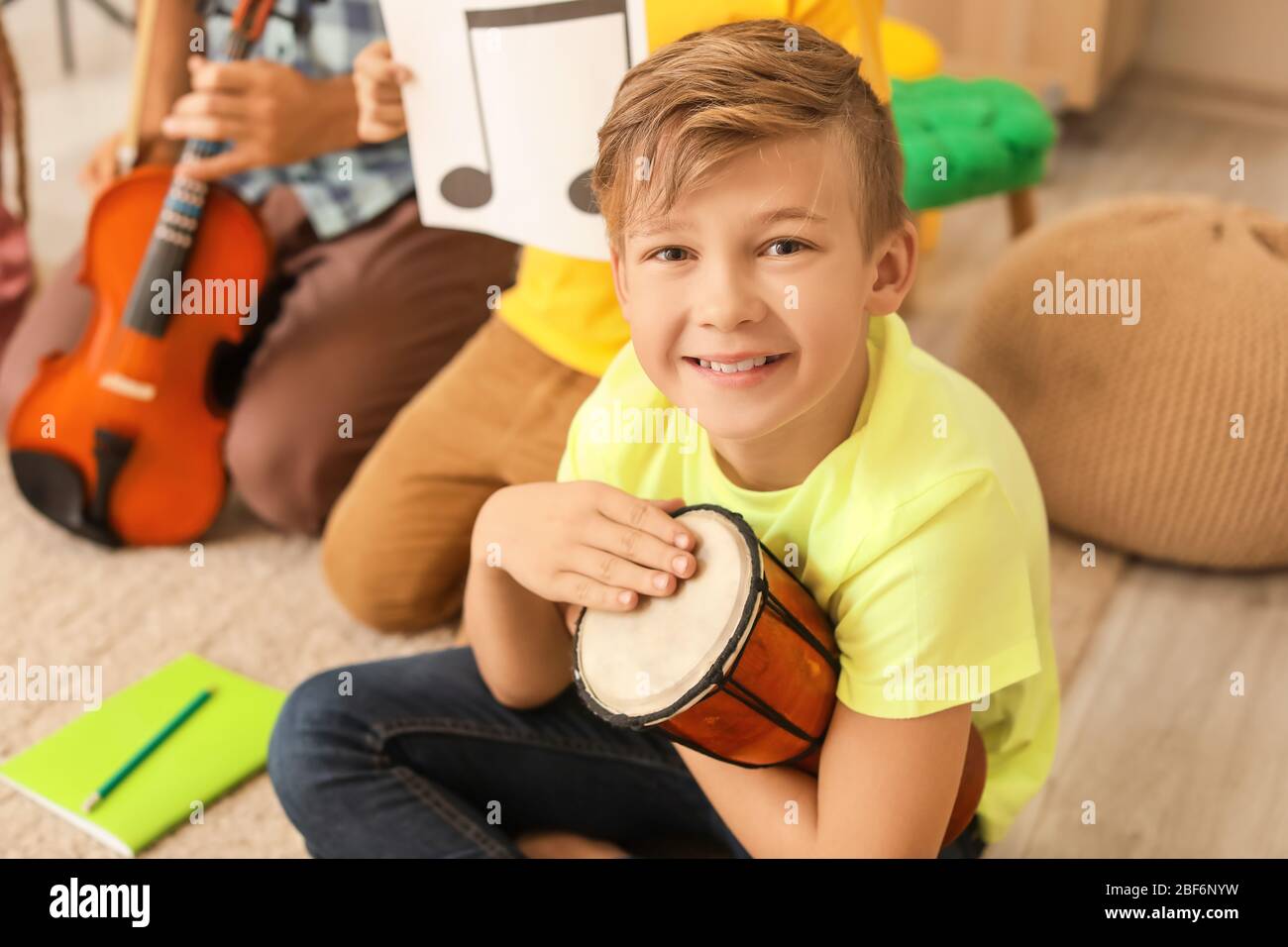 Cute little boy at music school Stock Photo - Alamy
