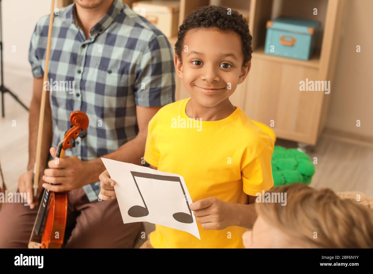 Cute little children at music school Stock Photo - Alamy