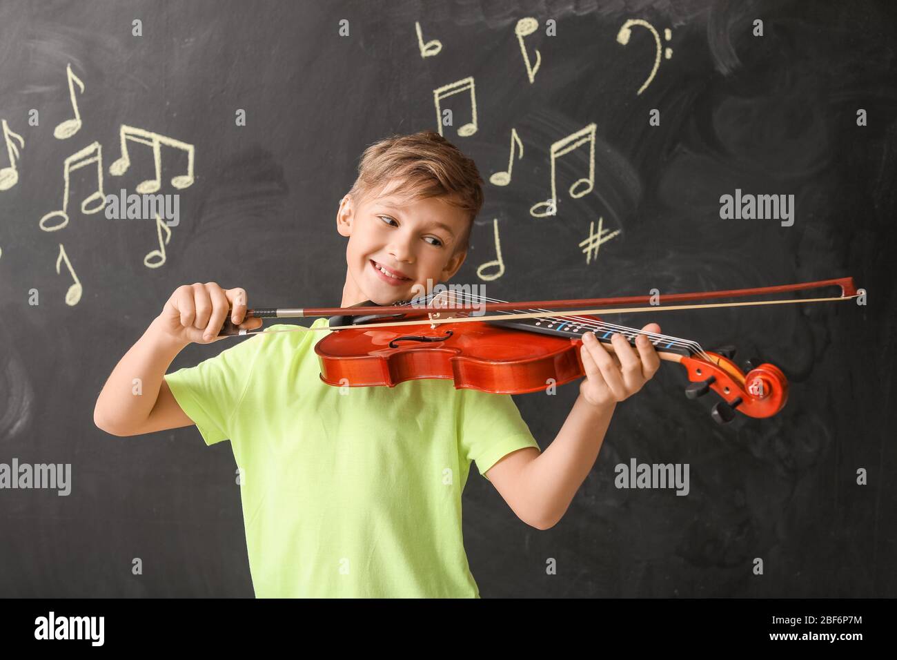 Little boy playing violin at music school Stock Photo - Alamy