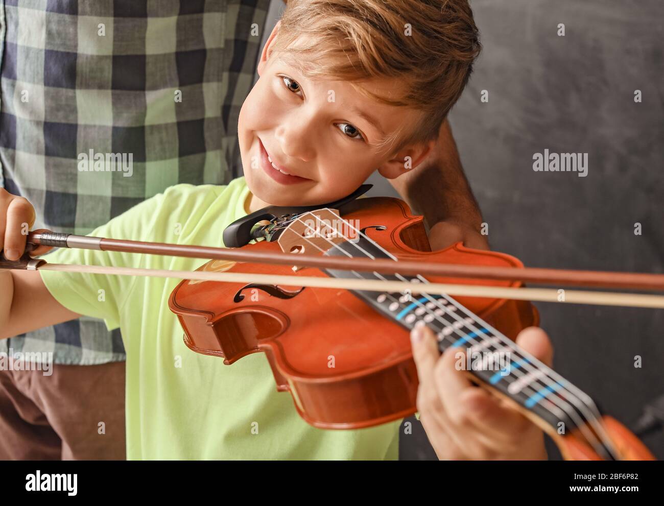 Little boy playing violin at music school Stock Photo - Alamy