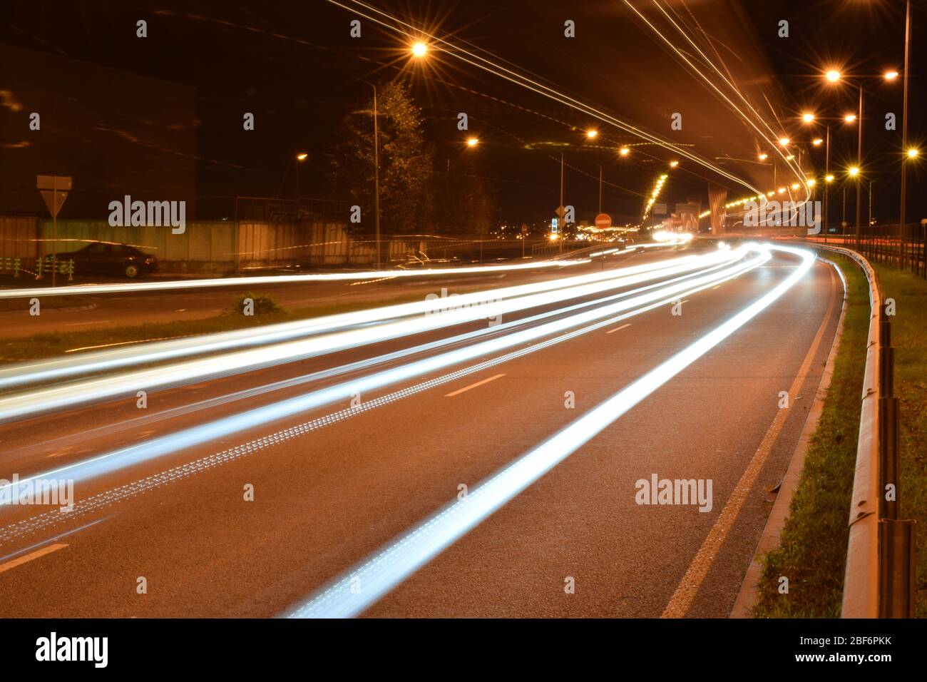 Car lights by the highway Stock Photo - Alamy