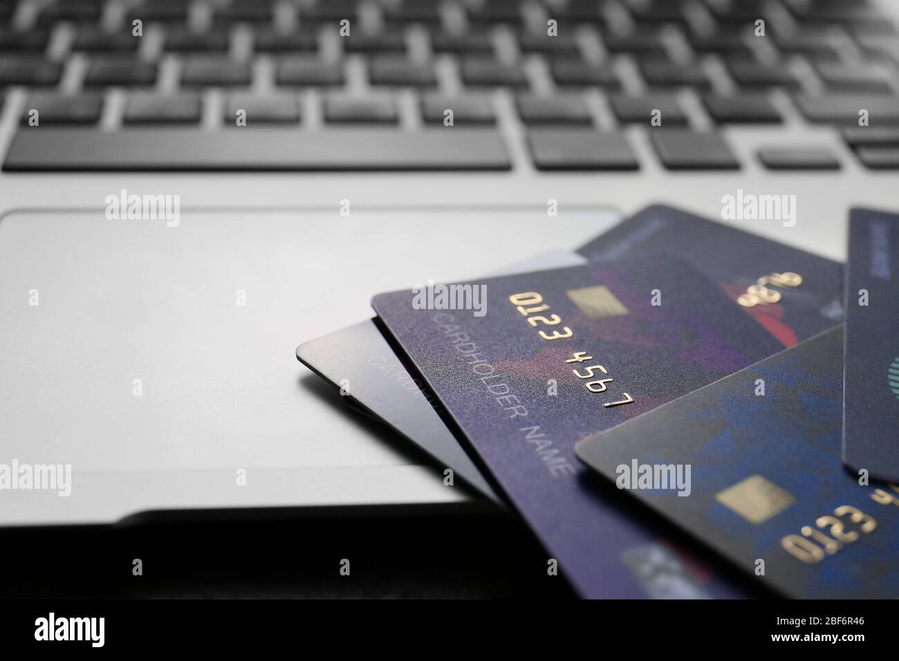 Credit cards with laptop, closeup Stock Photo - Alamy