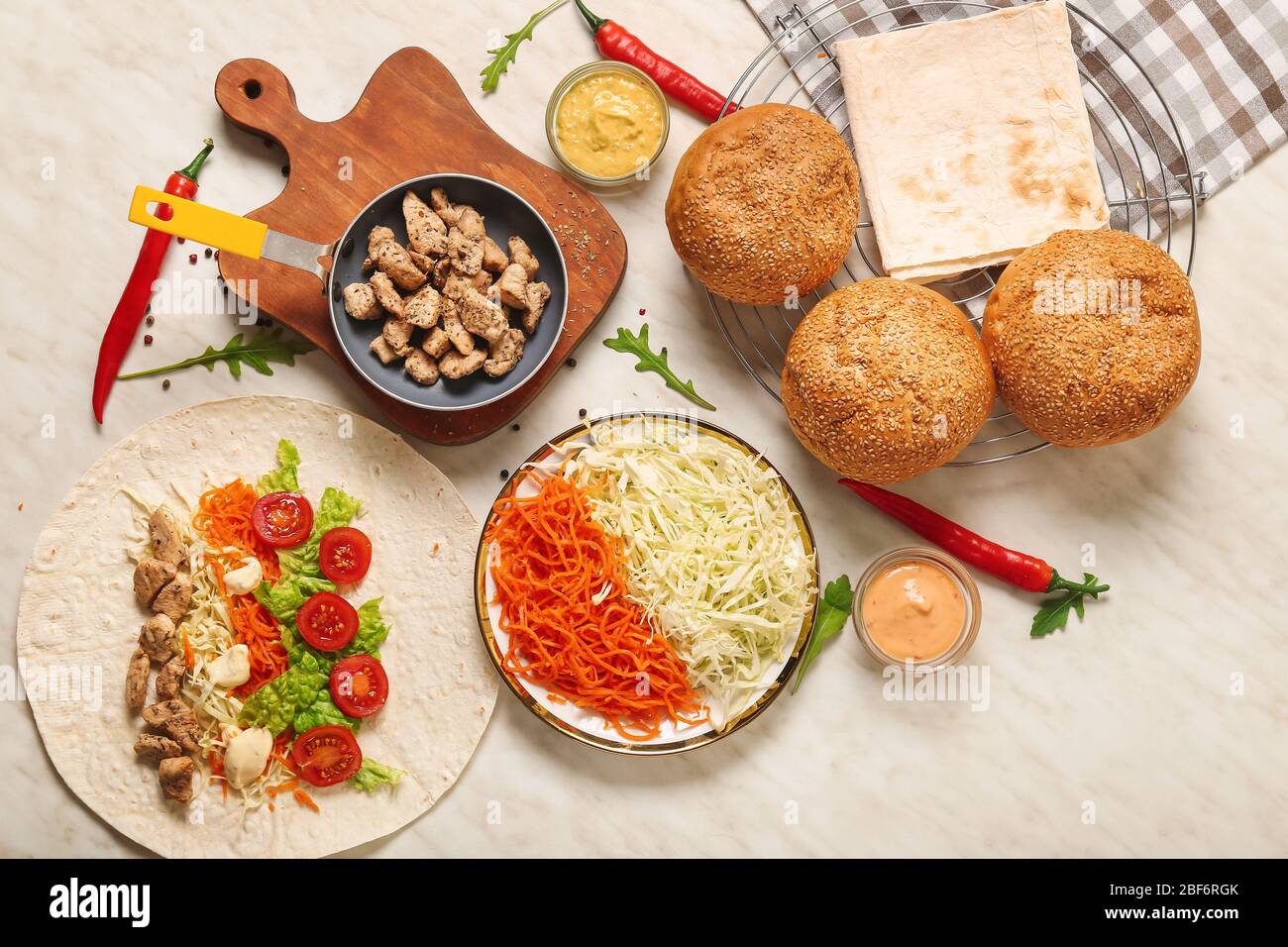 Ingredients for tasty doner kebab on table Stock Photo - Alamy
