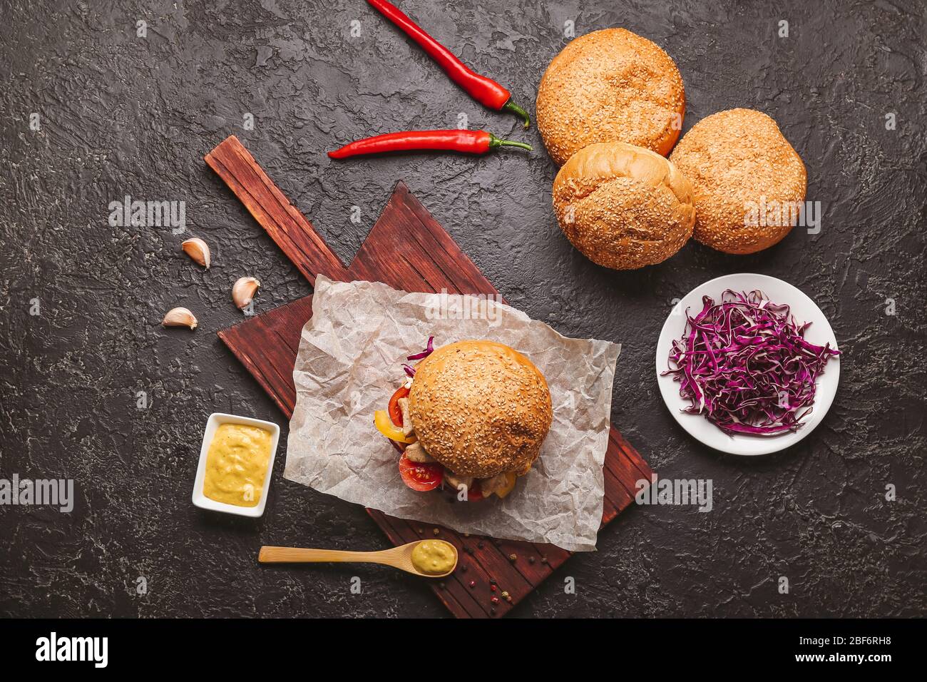 Tasty doner kebab in bun and sauce on dark background Stock Photo - Alamy
