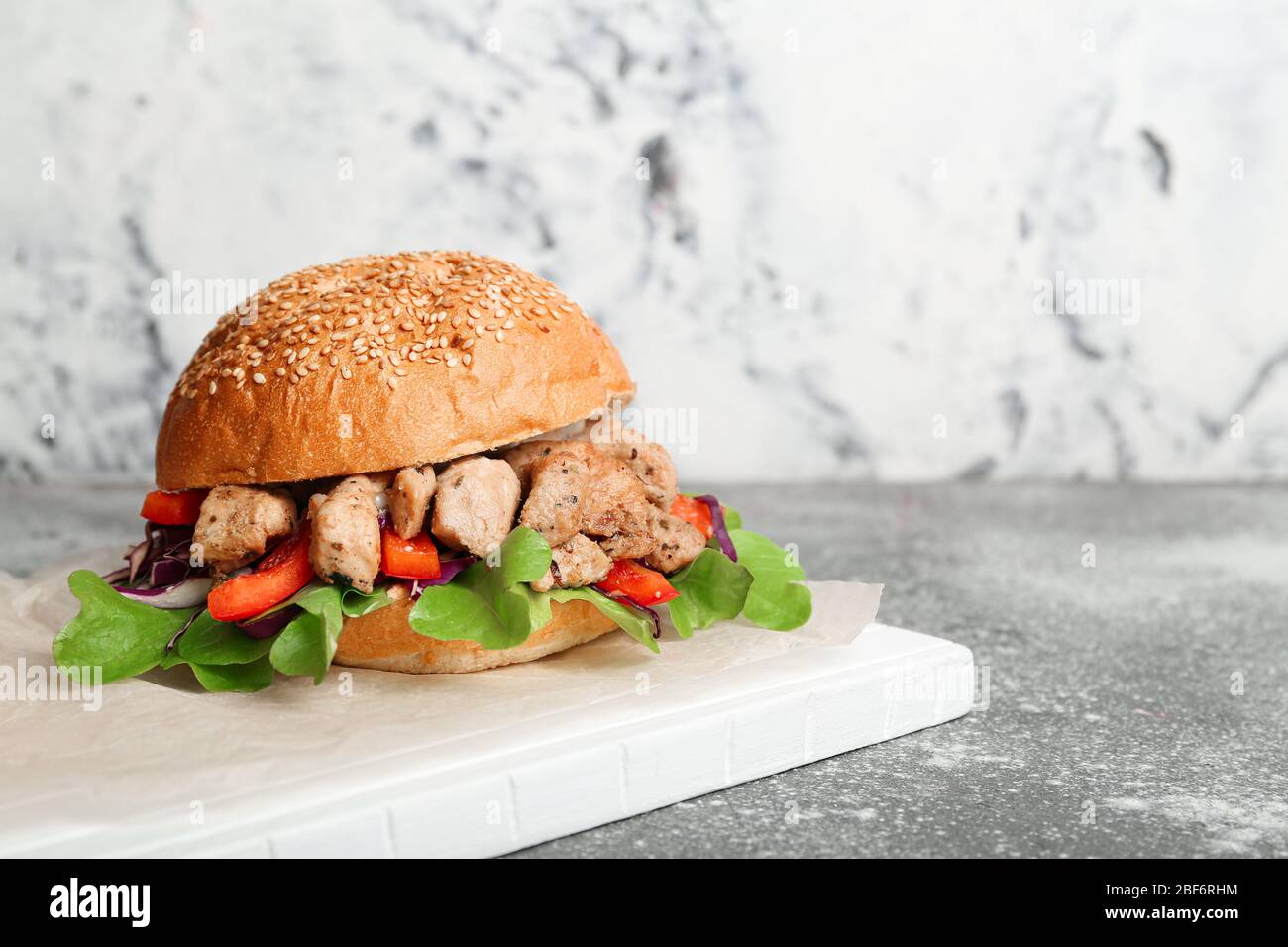 Tasty doner kebab in bun on table Stock Photo - Alamy