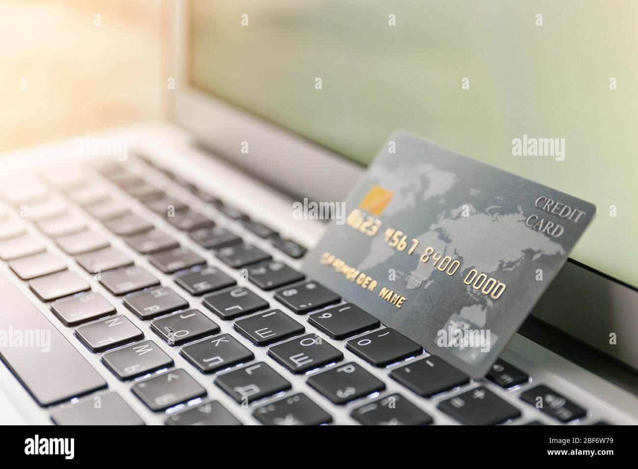 Credit cards on laptop, closeup. Concept of online banking Stock Photo ...