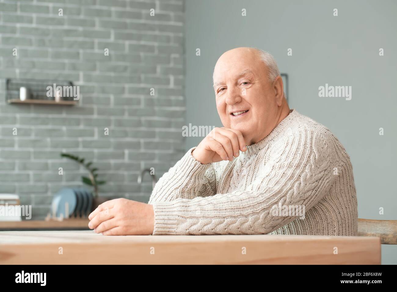 Portrait of elderly man at home Stock Photo - Alamy