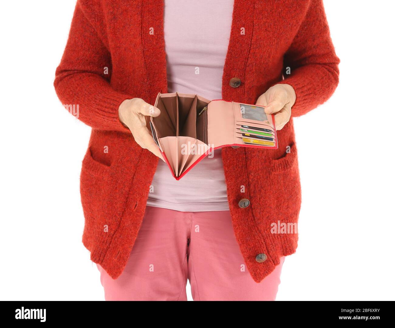 Senior woman with empty wallet on white background Stock Photo - Alamy