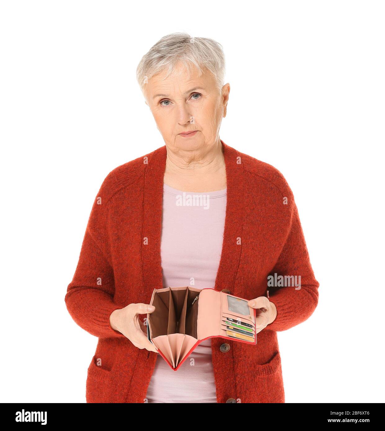 Senior woman with empty wallet on white background Stock Photo - Alamy