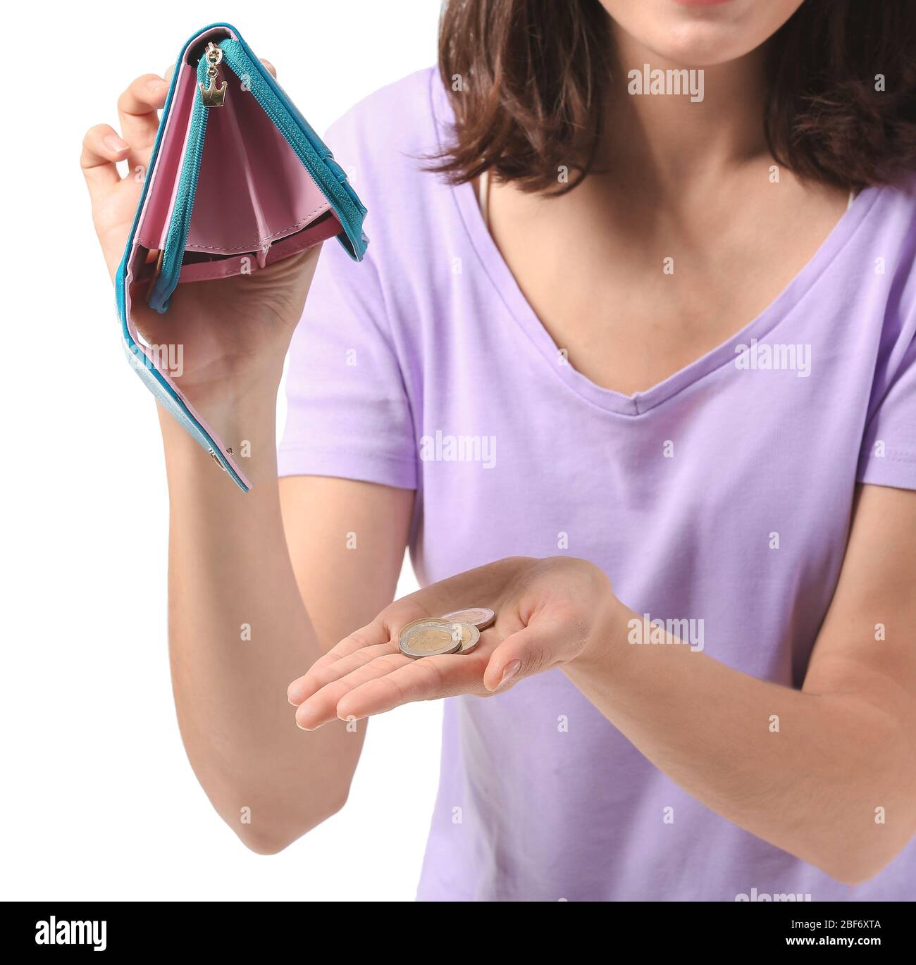 Young woman with empty wallet on white background Stock Photo - Alamy