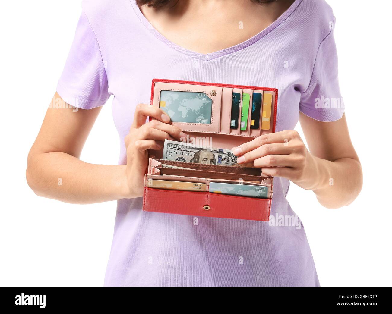 Young woman with wallet on white background Stock Photo - Alamy