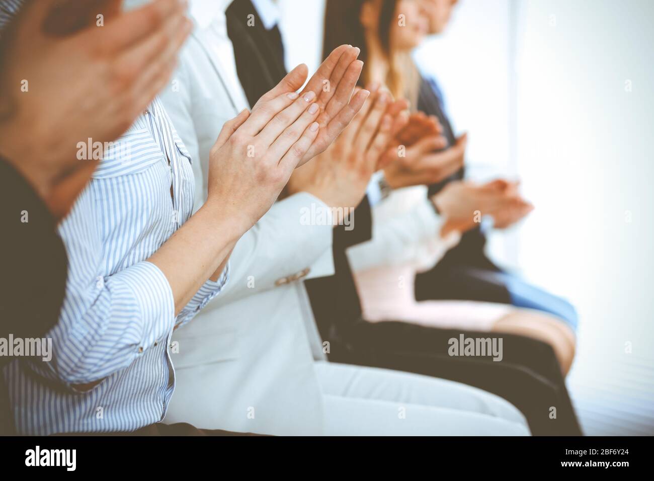 Business people clapping and applause at meeting or conference, close ...
