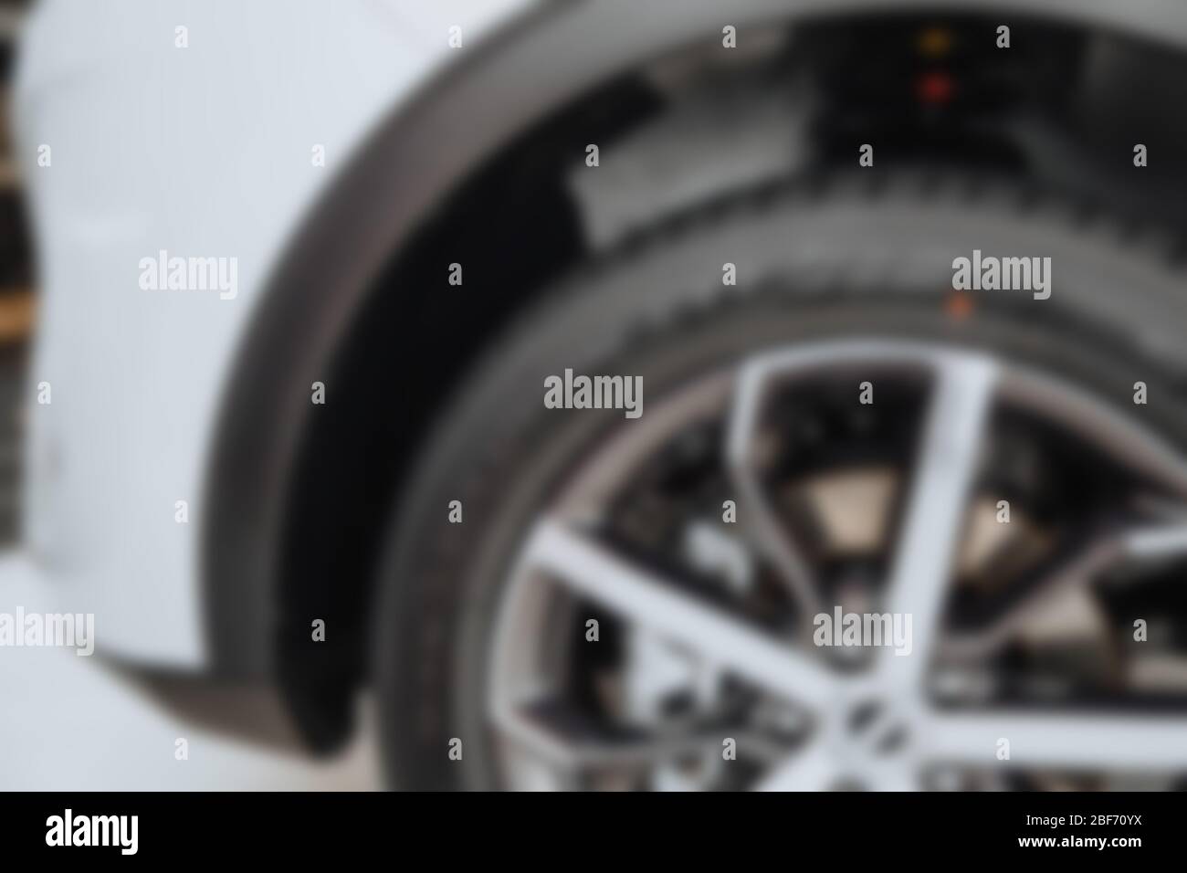 Motion blurred car wheel, blur background. Defocused Stock Photo - Alamy