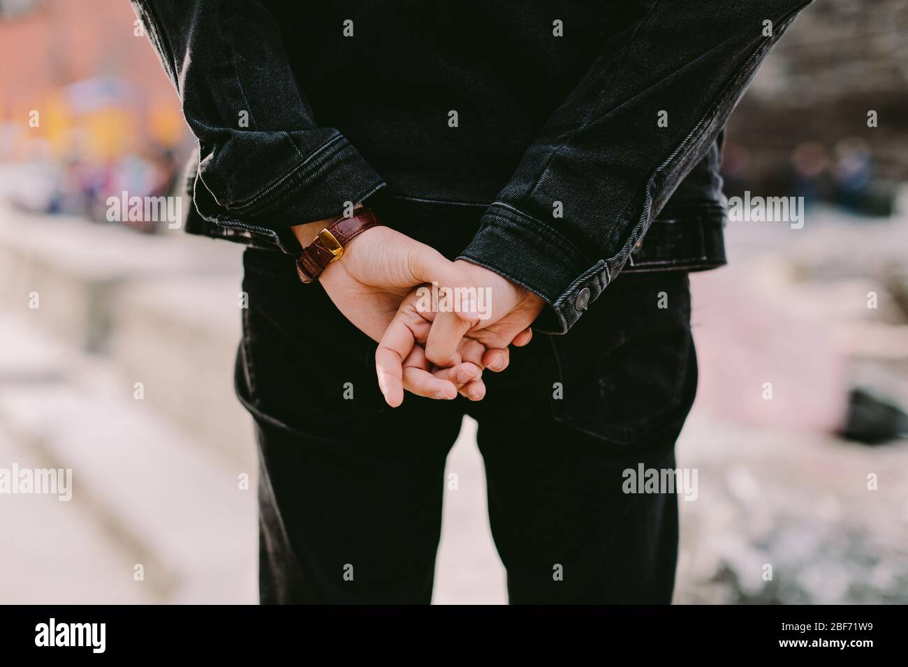 Holding hands behind his back hi-res stock photography and images - Alamy