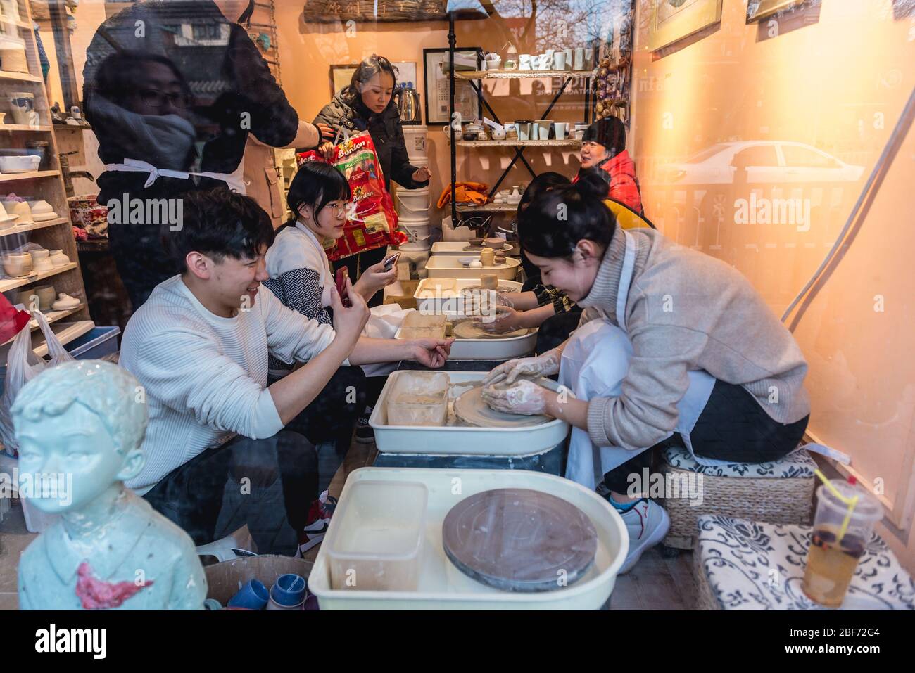 Pottery lesson at Gulou East Street in Beijing, China Stock Photo - Alamy